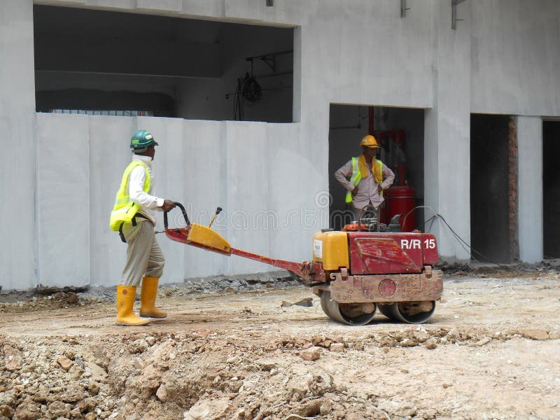 Construction Workers are Using the Baby Compactor To Level and Compact ...