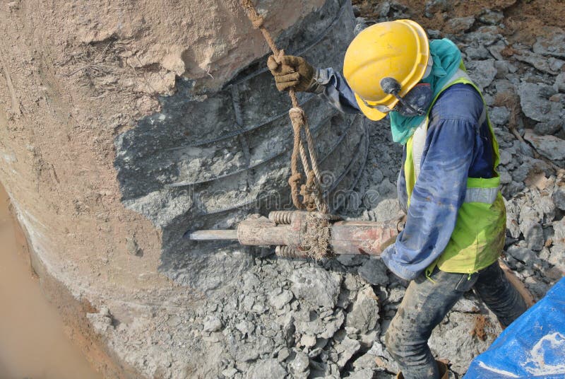 Construction Workers Using Mobile Concrete Hacker Construction Site ...