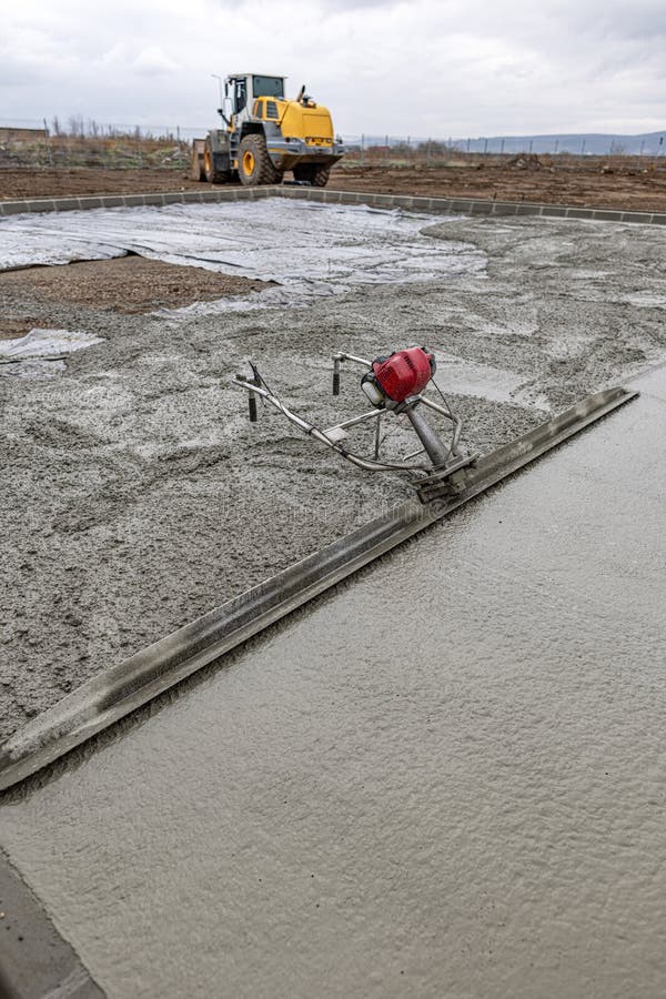 Construction Workers Using Power Screed Stock Photo - Image of ...
