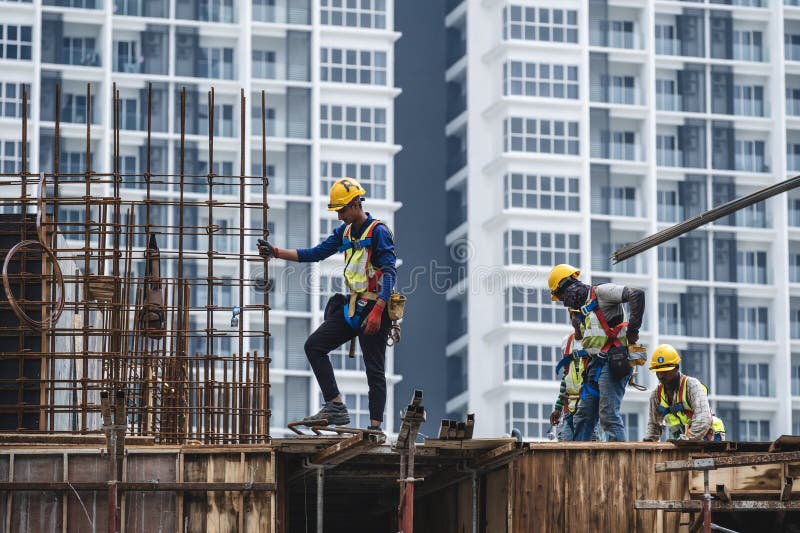 Construction Workers Wearing Safety Protective Equipment while Working ...