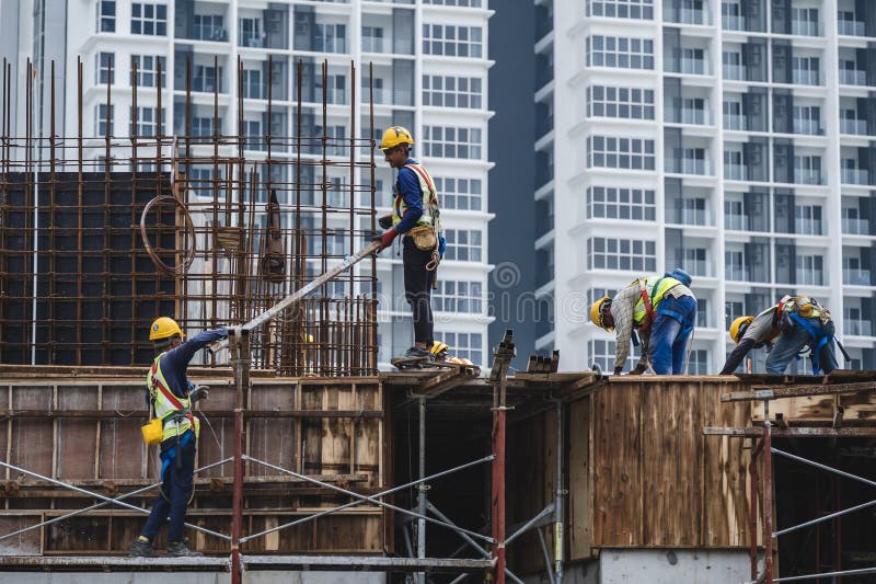 Construction Workers Wearing Safety Protective Equipment while Working ...