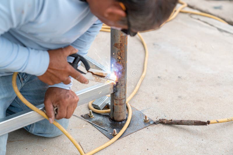 Construction Workers Withe Out Safety Gear Welding Steel Bar Stock ...