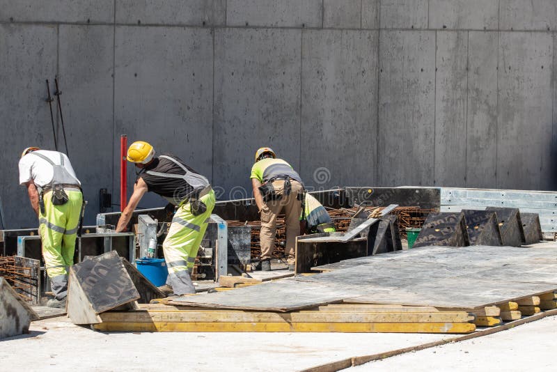Construction Workers at Work on a Construction Site Editorial Stock ...