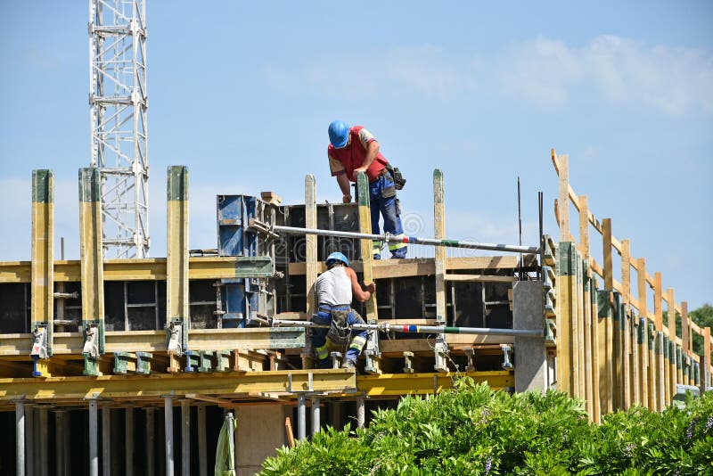 Construction Workers at Work Editorial Stock Image - Image of ...