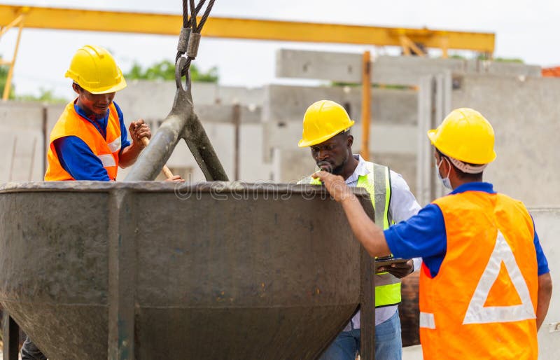 Construction Workers at Work, Foreman and Worker Team Discussing at ...