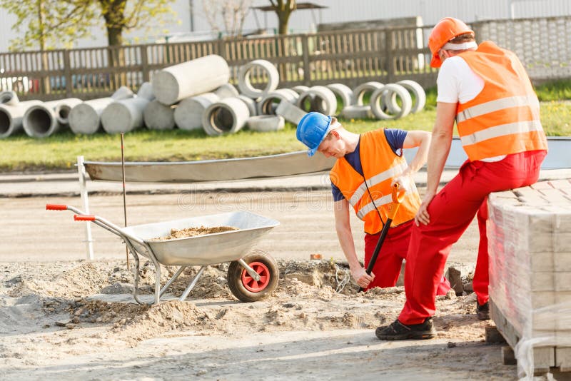 Construction Workers during Work Stock Photo - Image of equipment ...