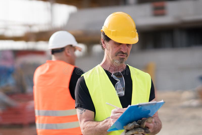 Construction Workers at Work Stock Image - Image of estate, clothing ...