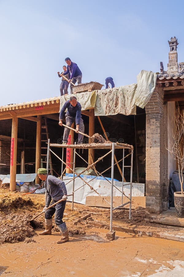 Construction Workers at Work with Traditional Building Materials ...
