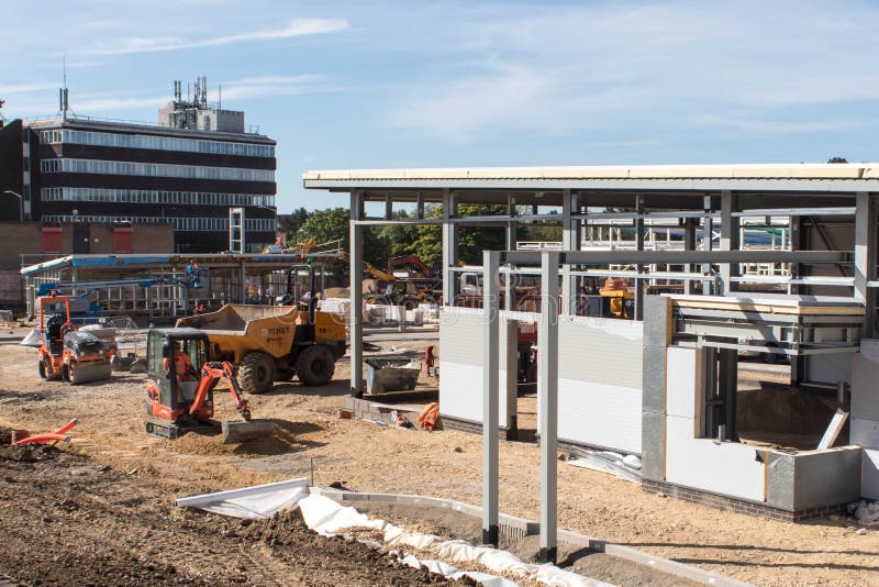 Construction Workers Working on Building Site with Idustrial Units ...