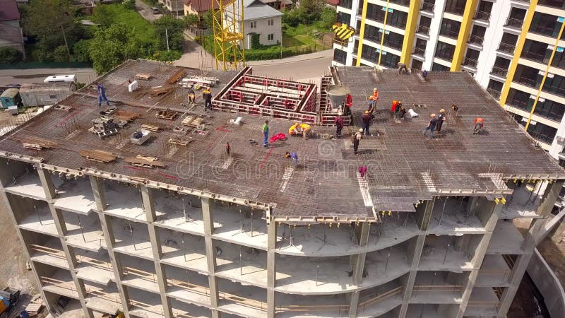 Construction Workers Working at Building Site of New Concrete ...