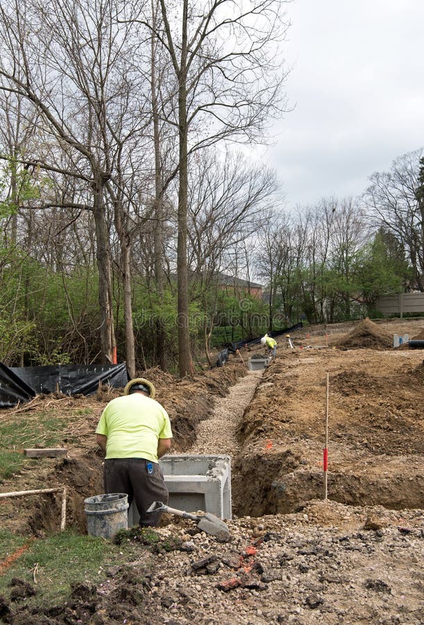Workers Cementing Corner Catch Basins in Place, Vertical Stock Image ...
