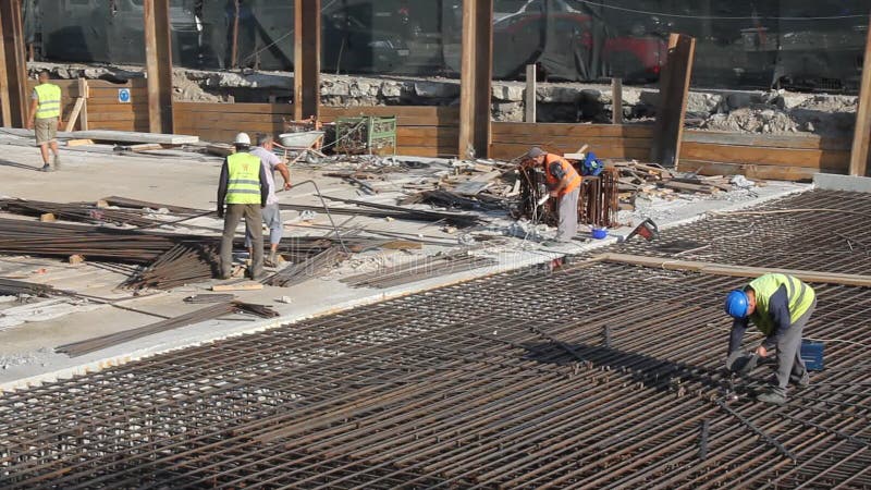 Construction Workers Pouring Concrete on Rebar Foundation, Residential ...