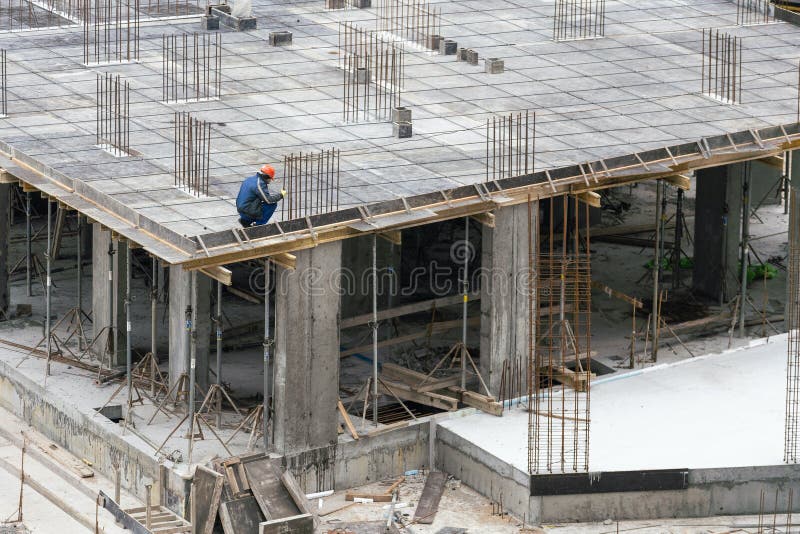 Construction Workers Working on Construction Machine. Aerial Platform ...