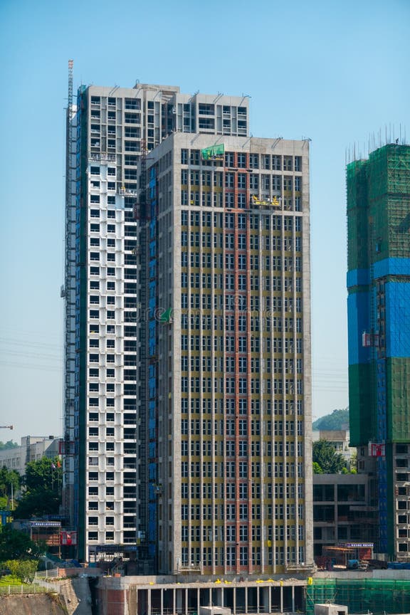 Construction Workers are Working on the Exterior Wall Under the ...