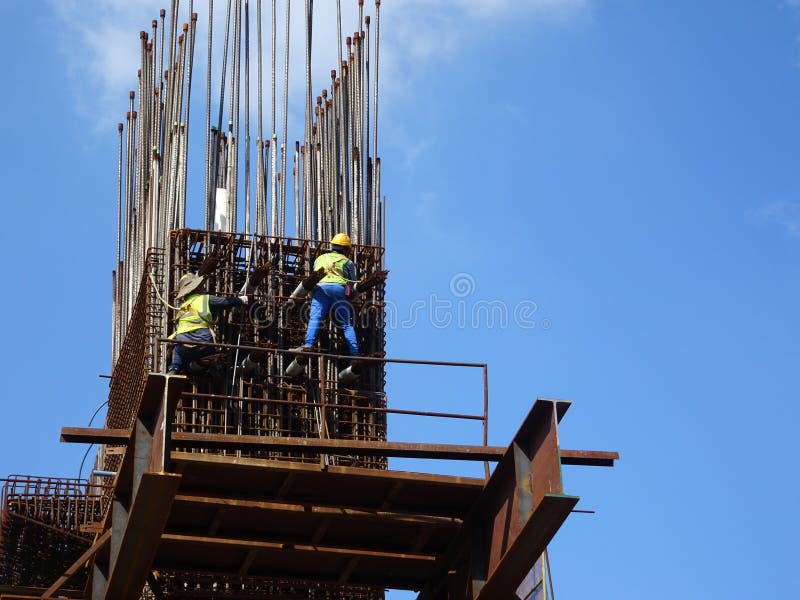 Construction Workers Working at Height at the Construction Site ...