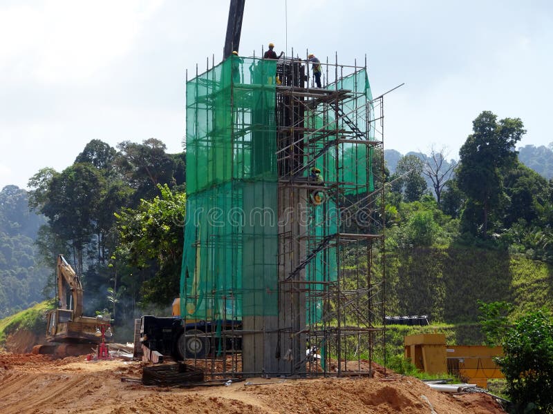 Construction Workers Working at Height at the Construction Site ...