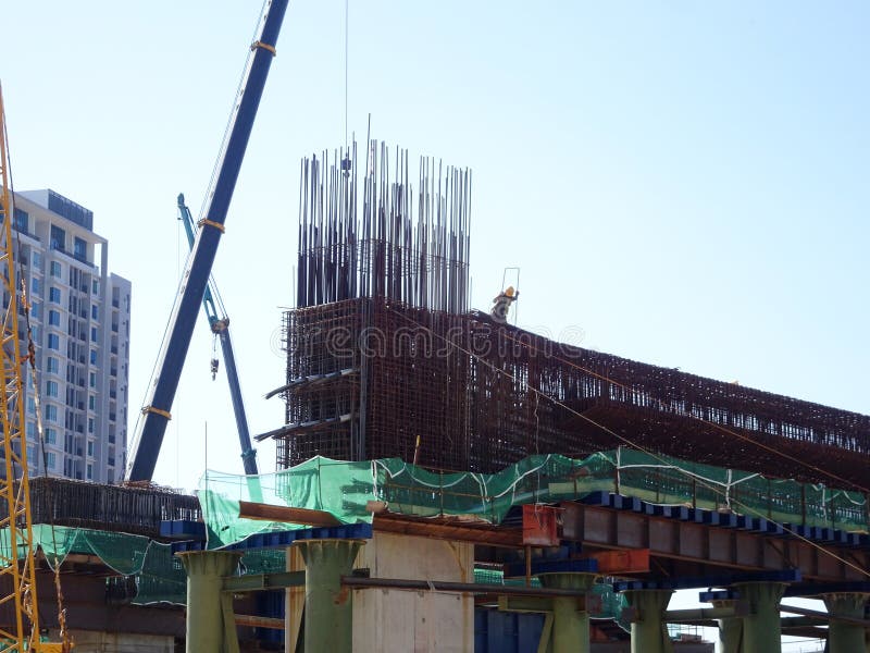 Construction Workers Working at Height Install Reinforcement Bars at ...