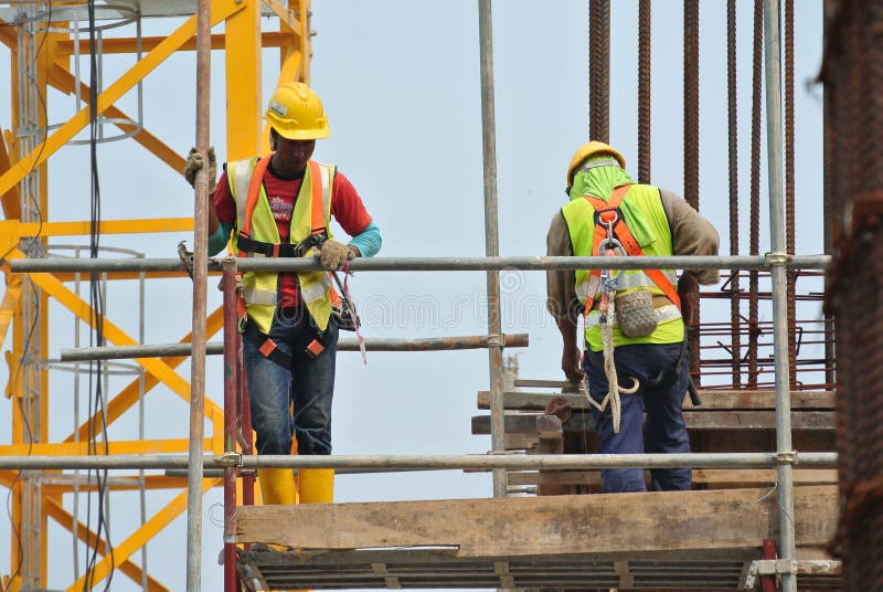 Construction Workers Working at Height at the Construction Site ...