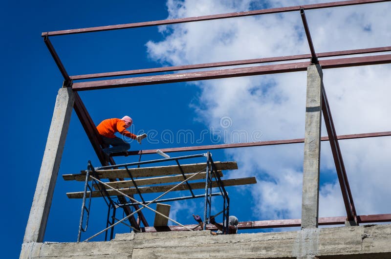 Construction Workers Working on High. Stock Photo - Image of ...