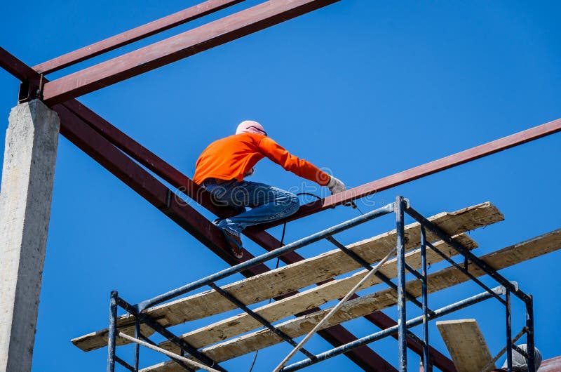 Construction Workers Working on High. Stock Photo - Image of ...