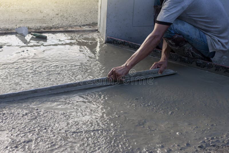 Construction Workers are Working by Leveling the Concrete Floor. Stock ...