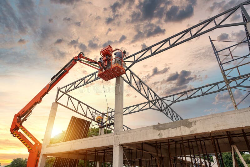 Construction Workers Working on Construction Machine. Aerial Platform ...