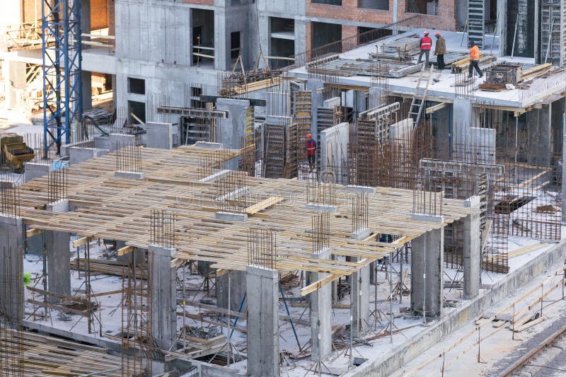 Construction Workers Working on Construction Machine. Aerial Platform ...