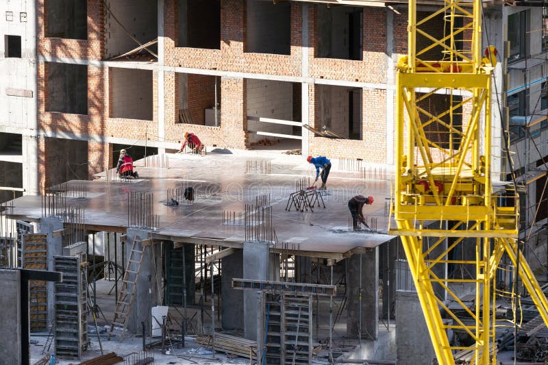 Construction Workers Working on Construction Machine. Aerial Platform ...