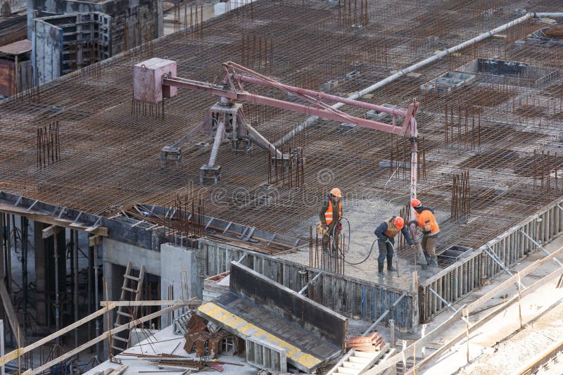 Construction Workers Working on Construction Machine. Aerial Platform ...