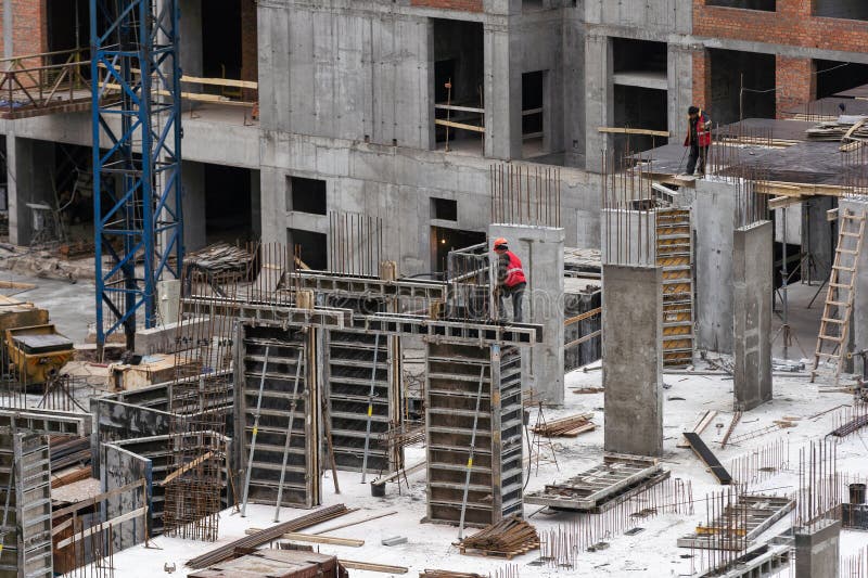 Construction Workers Working on Construction Machine. Aerial Platform ...