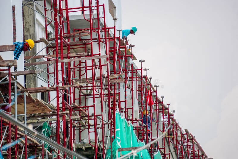 Construction Workers Working on Red Scaffolding Editorial Photography ...