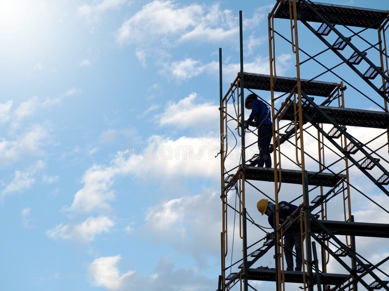 Man Working on the Working at Height on Construction Stock Photo ...