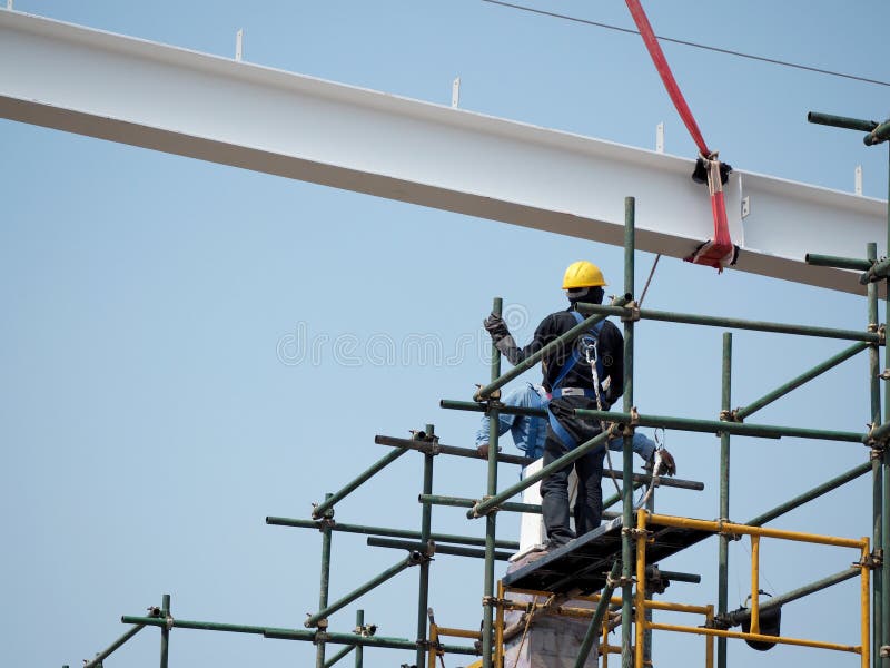 Man Working on the Working at Height on Construction Stock Photo ...