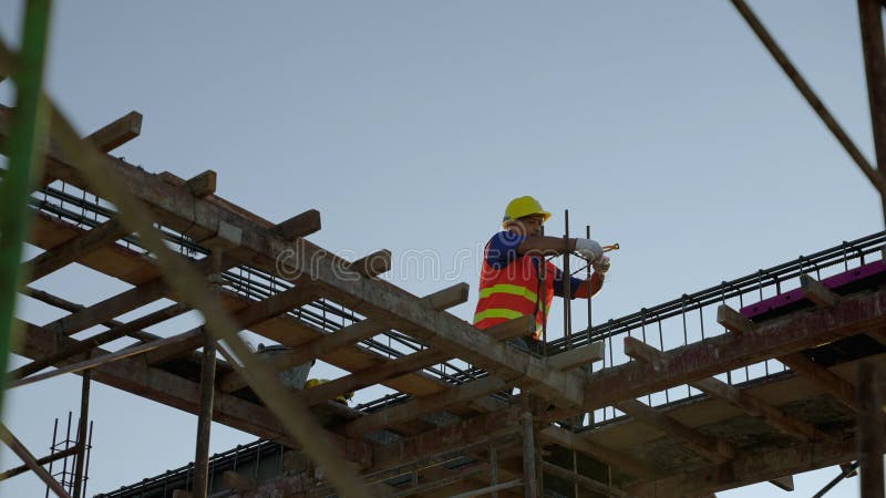 Construction Workers Working on Scaffolding Work at Risky Heights ...