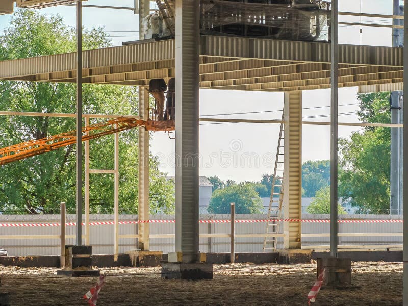 Construction Workers are Working on the Steel Framework of an ...