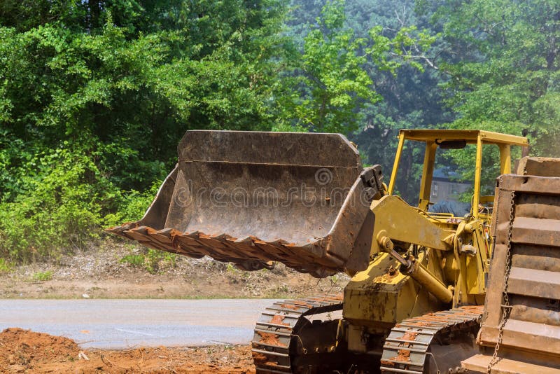 Construction Works on a Construction Site Using an Excavator Tractor ...