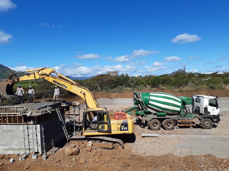 Construction Works Ongoing, Worksite with Workers and Heavy Machines ...