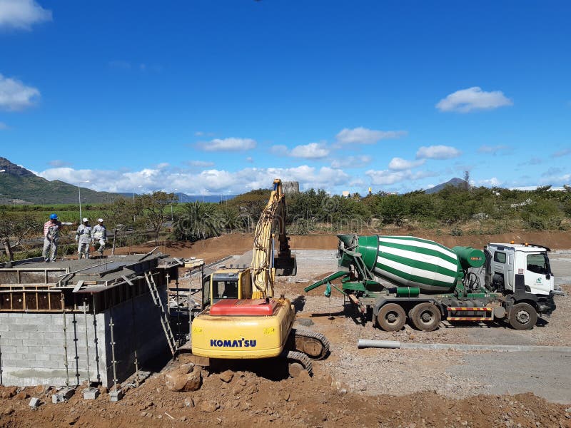 Construction Works Ongoing, Worksite with Workers and Heavy Machines ...