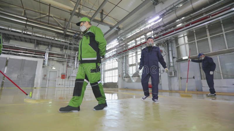 Construction of a Workshop at the Plant. Workers at a Construction Site ...