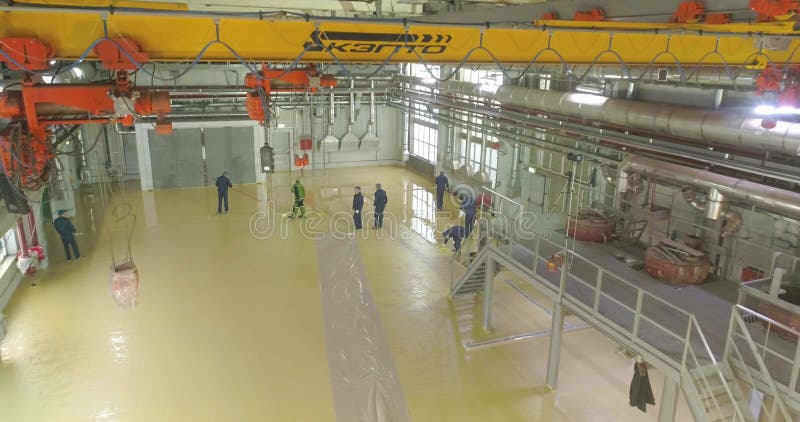 Construction of a Workshop at the Plant. Workers at a Construction Site ...