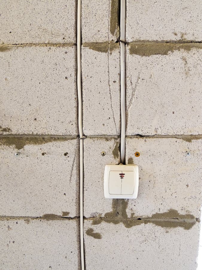 Constructively, a Switch for Light on a Stone Wall. Stock Image - Image ...