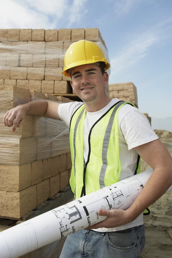 Constructor Holding a Blueprint Stock Photo - Image of middle, labor ...