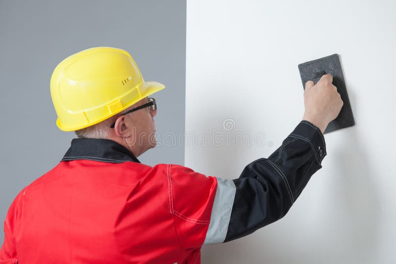 Constructor Que Sostiene Una Paleta Foto de archivo - Imagen de ...