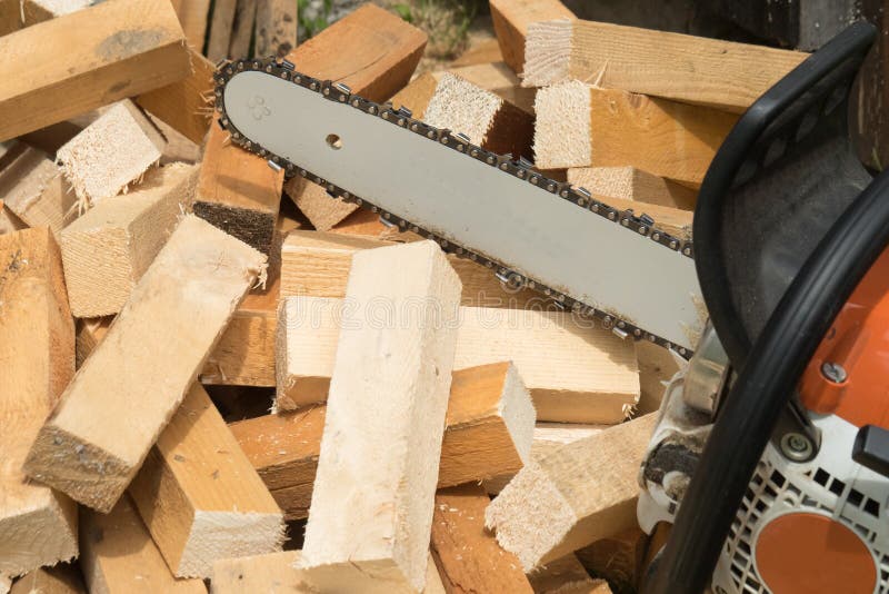 Constructor Worker Cutting Planks with Chainsaw Stock Photo - Image of ...