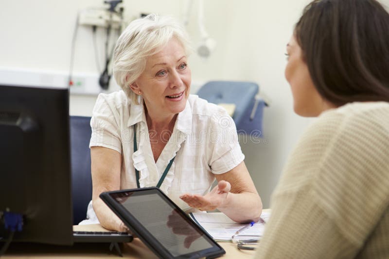 Consultant Showing Patient Test Results on Digital Tablet Stock Photo ...