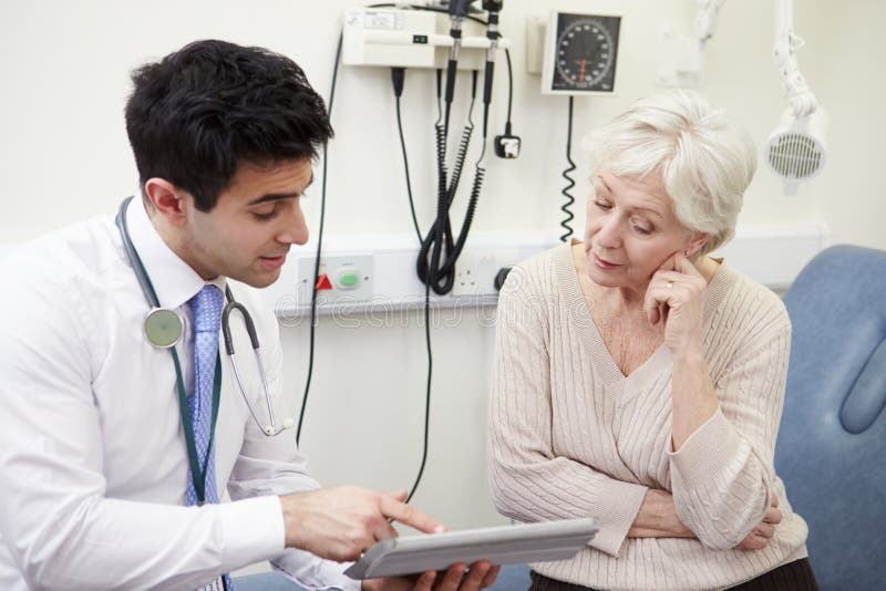 Consultant Showing Patient Test Results on Digital Tablet Stock Photo ...