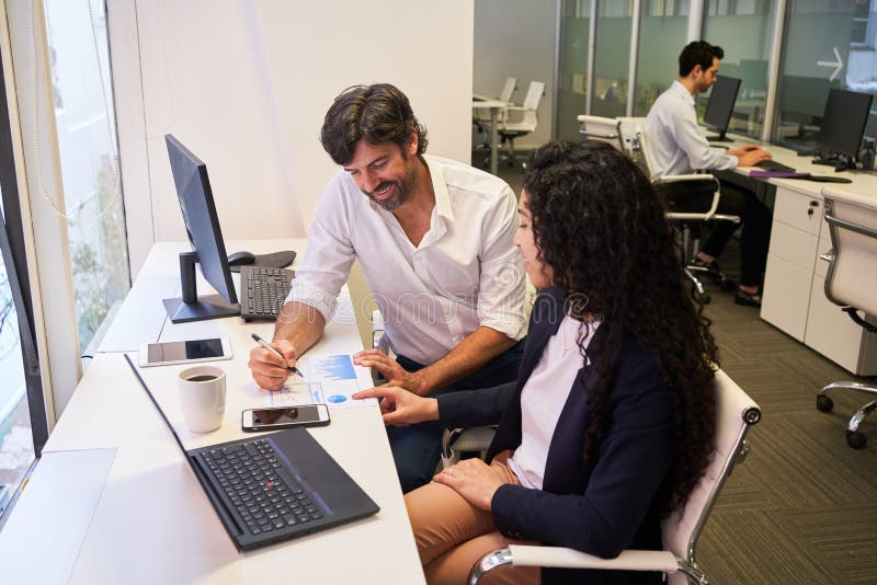 Consultants and Trainees Work Together on Financial Analysis Stock ...