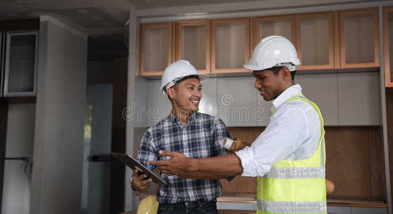 Consulting Engineer Collaborating on Construction Project with ...