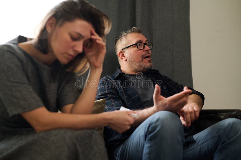 Consulting Therapist in Thoughtful Conversation with Client Stock Image ...