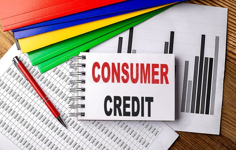 CONSUMER CREDIT Text on Notebook with Folder on Chart Stock Photo ...